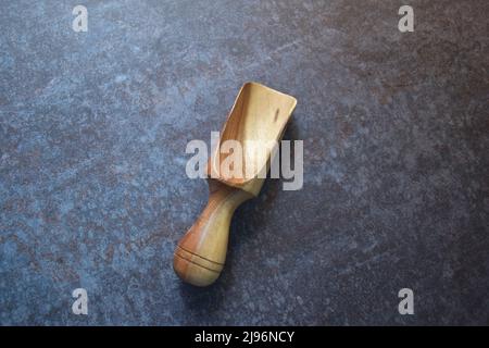 Empty wooden food grains measuring scoop Stock Photo - Alamy