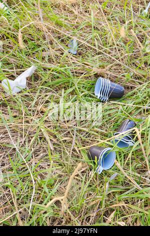 Plastic garbage thrown out green lawn Stock Photo - Alamy