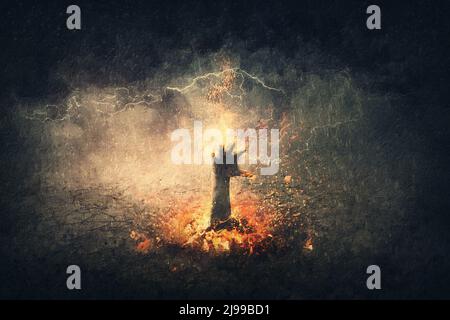 Zombie hand rising out of the ground in a spooky dark forest with ...