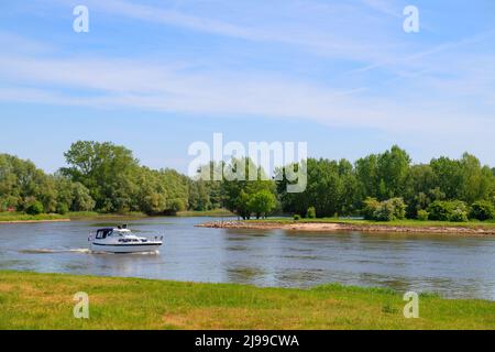 Landscape Dutch river the IJssel with motor boat Stock Photo - Alamy