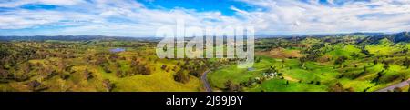 Scenic wide aerial panorama of Bega Valley green pasture meadows on ...