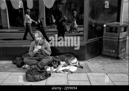 Homeless Busker playing on the street in Bath Stock Photo - Alamy