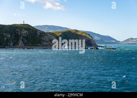 Pencarrow Heads lighthouses and coastal scene when leaving Wellington ...