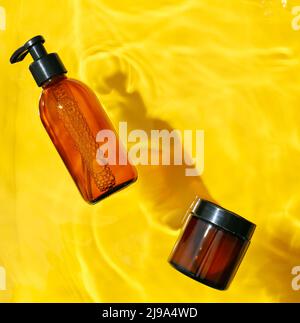 Yellow bottle of shampoo on creative blue background, top view Stock ...