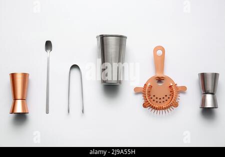 Copper bartender tools on grey background Stock Photo - Alamy