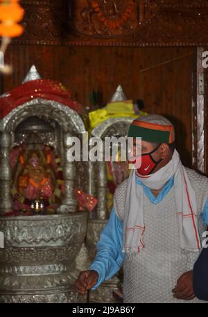 A Pujari or Hindu priest wearing traditional outfit makes the Mudra ...