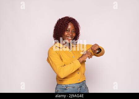 black lady pointing to her watch, time conscious gesture Stock Photo ...
