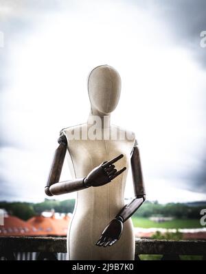 The head of a white female mannequin with gray hair and a silver ...