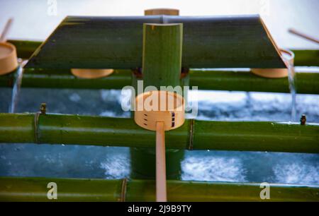 Purification trough at Oomiya hachiman shrine in Tokyo Stock Photo - Alamy