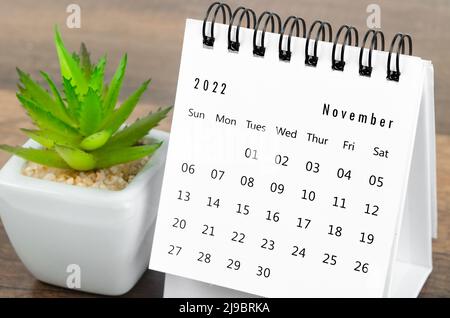 The November 2022 desk calendar with plant on marble table Stock Photo ...