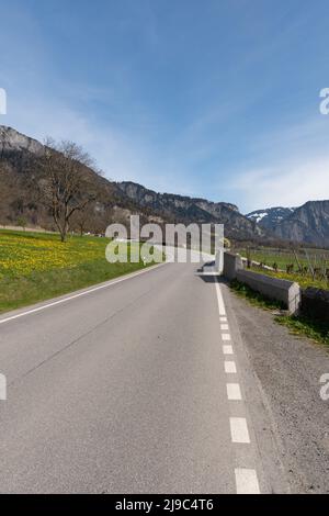 Maienfeld, Grison, Switzerland, April 11, 2022 Empty street along the ...