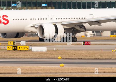 Swiss Boeing 777 landing at Zurich Airport. Airplane 777-300ER of Swiss ...