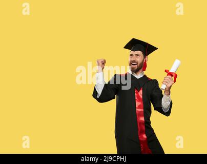 Front view of male student graduating from high school. Handsome man ...
