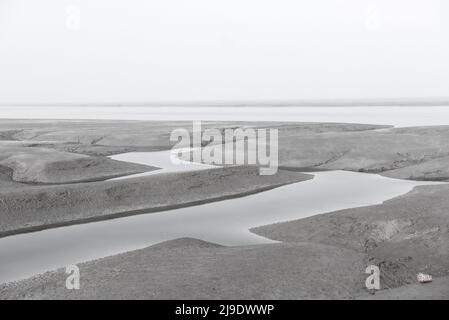 The beautiful and curious tidal mud flat Stock Photo - Alamy