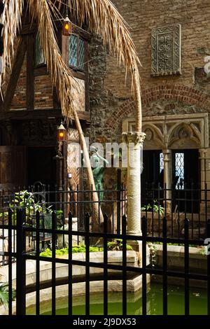 Views of a middle eastern inspired facade around the pool within the ...