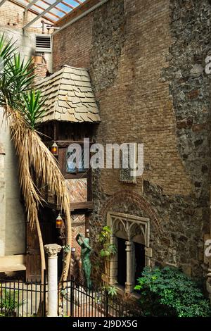 Views of a middle eastern inspired facade around the pool within the ...