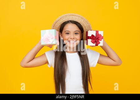 happy girl with giftbox on yellow background. boxing day. present and ...