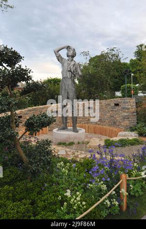 The RAF Benevolent Fund Garden. A young pilot looks up at the sky ...