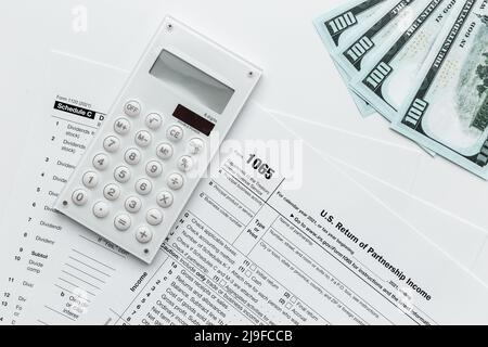 Tax form under US law with culculator on office table desktop Stock ...