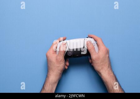 Hand hold new joystick. Gamer play game with gamepad controller. Gaming ...