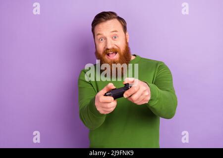 Photo of positive handsome foxy guy promote new playstation joystick ...