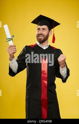 Front view of man with beard graduating from university, college ...