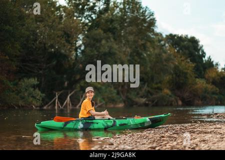 Relaxed Kayaker on the Lake. Caucasian Sportsman. Water Sports and ...