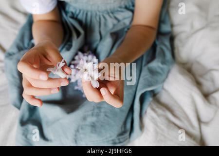 Children holding violet Stock Photo - Alamy