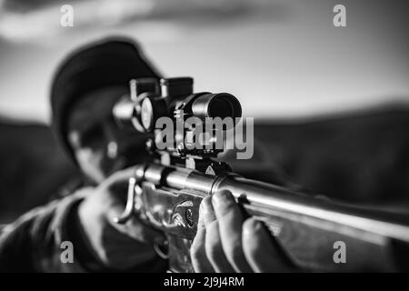 Close up snipers carbine at the outdoor hunting. Gun rifle. Hunter with ...