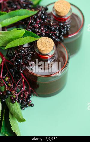 A glass of black elderberry syrup - alternative herbal remedy Stock ...