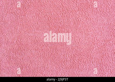 close up light pink microfiber texture. Cleaning rag fluffy cloth on ...