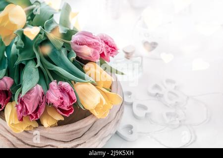 Multicolored tulips in a wooden textured box, selective focus, copy ...