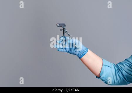 Proctological tools for examination of patient in hands of doctor ...