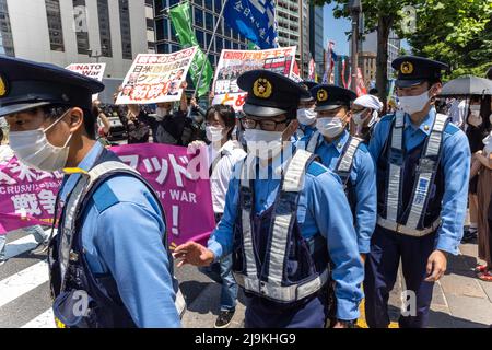 A group of policemen gathered on May 15, 1932, outside the home of ...
