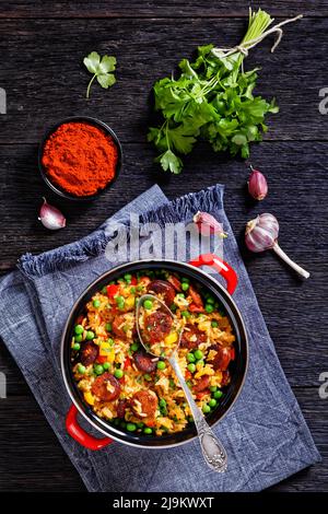 browned smoked sausages with rice, bell pepper, onion and green peas in ...