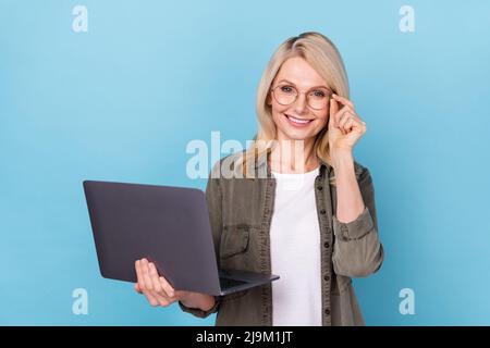 Photo of charming aged lady hold use smart phone telephone wear shirt ...