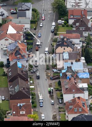 An aerial photo shows buildings damaged by a sudden gust of wind ...