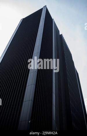 Converging vertical geometry. Tower office block in a modern business ...