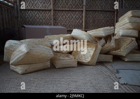Traditional bamboo woven boxes called Besek in a warehouse at Brajan ...