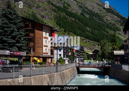 View of the main city center of Zermatt with old historic buildings ...