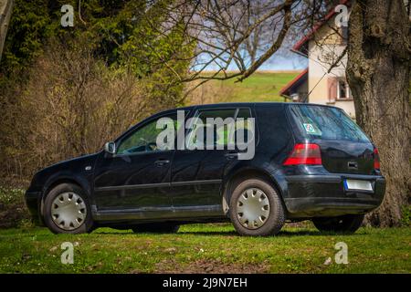 Black old dirty scratched car on morning meadow in fresh spring Stock ...