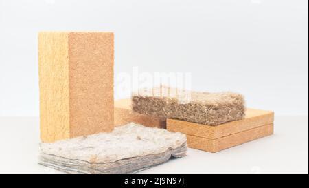 wooden fibers thermal insulation blocks on a white background - energy ...