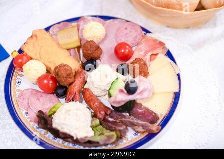 typical plate of Romanian appetizers that have stuffed tomato, cucumber ...