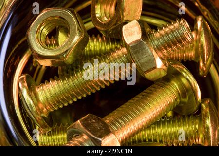 Metallic nuts and bolts in lubrication oil Stock Photo - Alamy