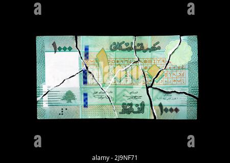 Ripped one thousand Lebanese pounds bill, currency of Lebanon Stock ...
