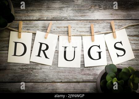 A set of printed cards spelling the word UTAH on an aged wooden ...