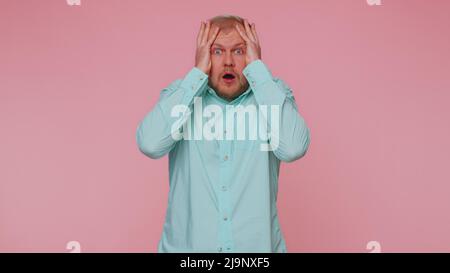 Scared fearful depressed man expresses his fear and waves his hands ...