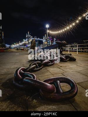 Chain and Anchor at Butlers Wharf with view of Tower Bridge Stock Photo ...