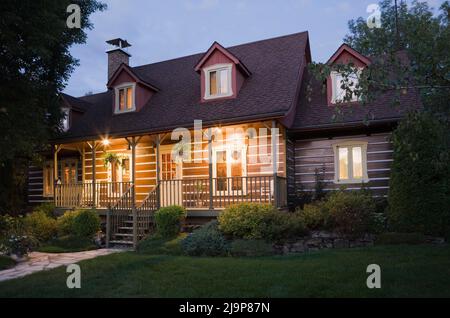Replica of old 1800s Canadiana cottage style fieldstone home with white ...