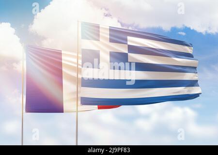 Greece and France flags waving together on blue sky, two country ...